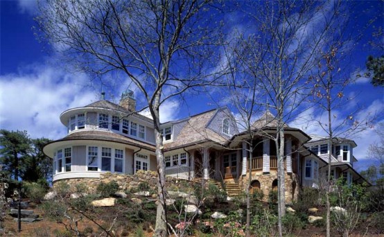 Curved House Design with Extensive Interior Woodwork - DigsDigs