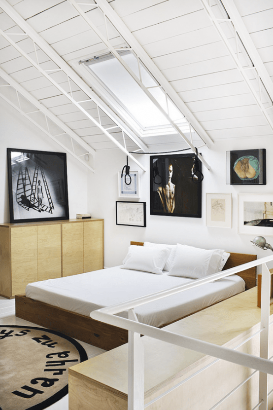 Stylish Eclectic Loft With Clusters Of Art And Framed Photographs ...